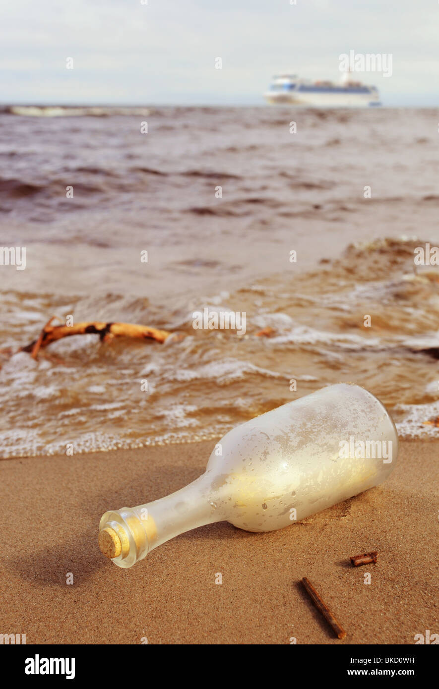 Message in a bottle on a sea beach Stock Photo - Alamy