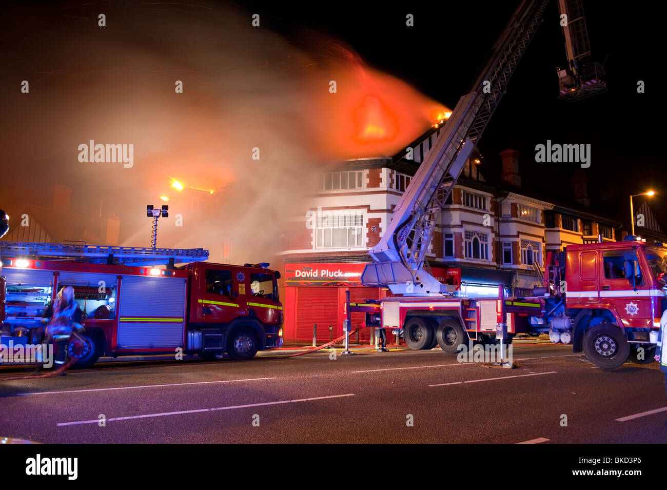 Shop on fire at night on high street UK Stock Photo - Alamy