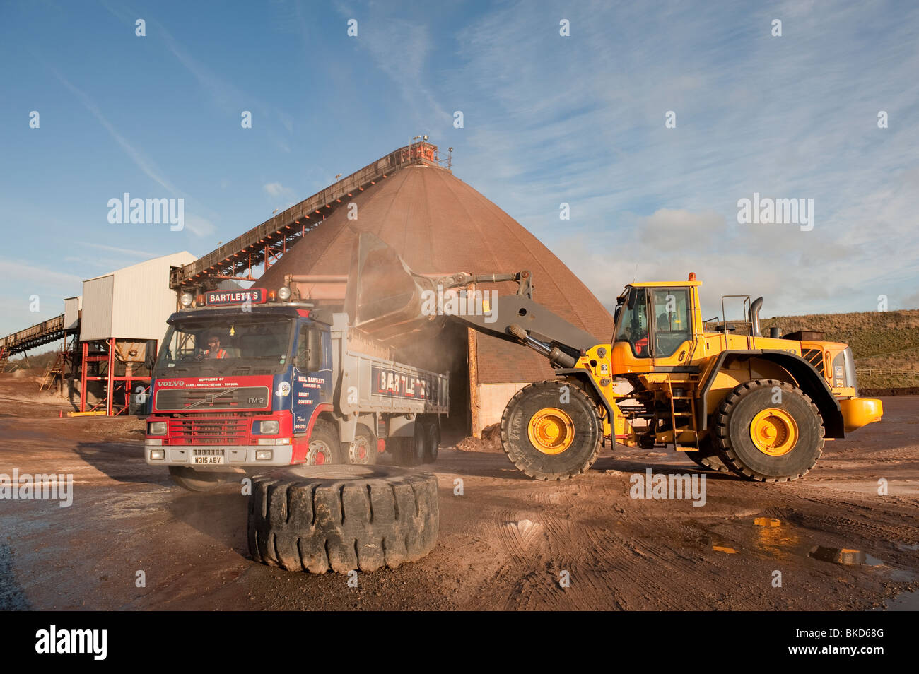 Loading Rock Road salt into lorry at mine Stock Photo - Alamy