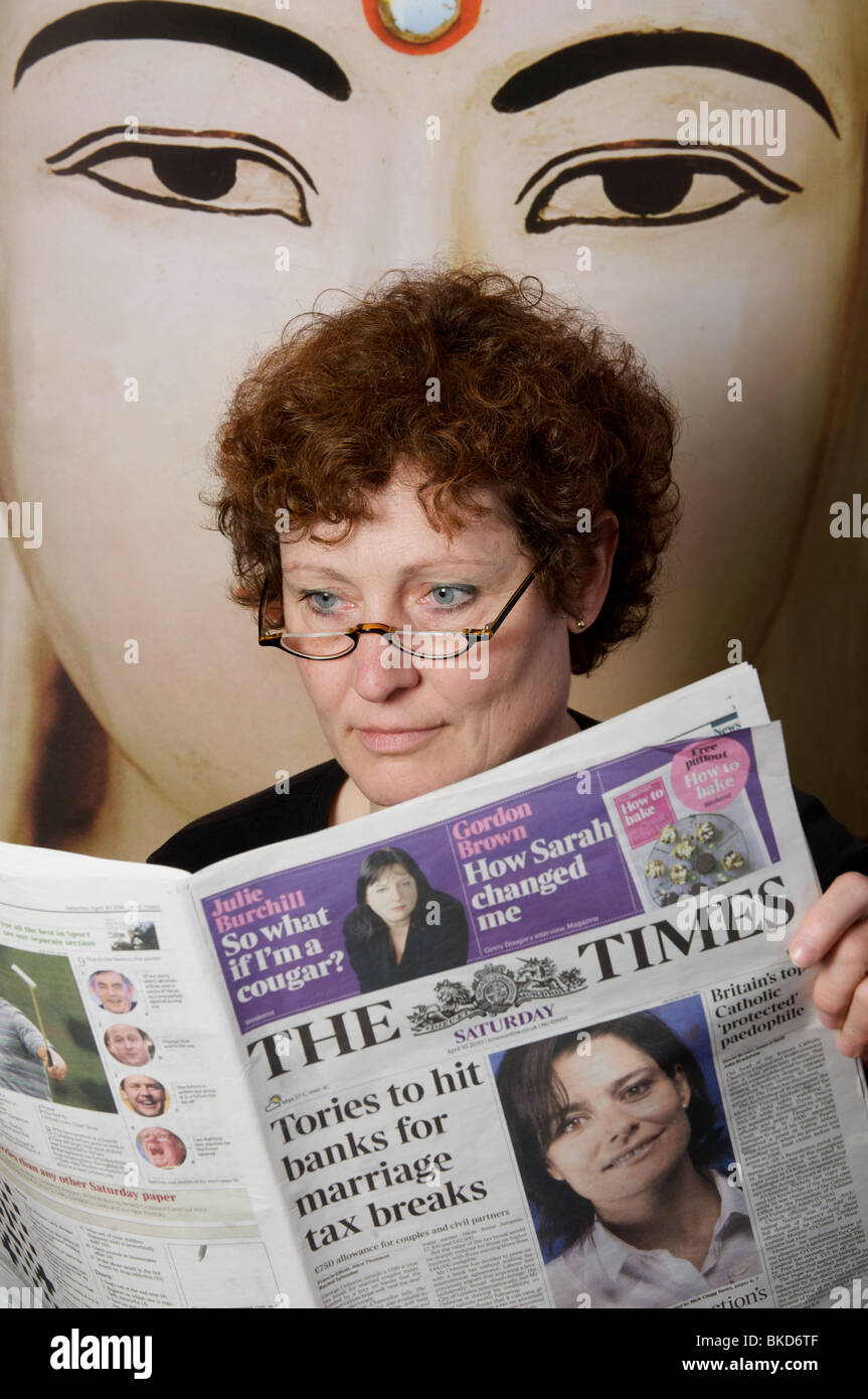 Woman reading times newspaper hi-res stock photography and images - Alamy