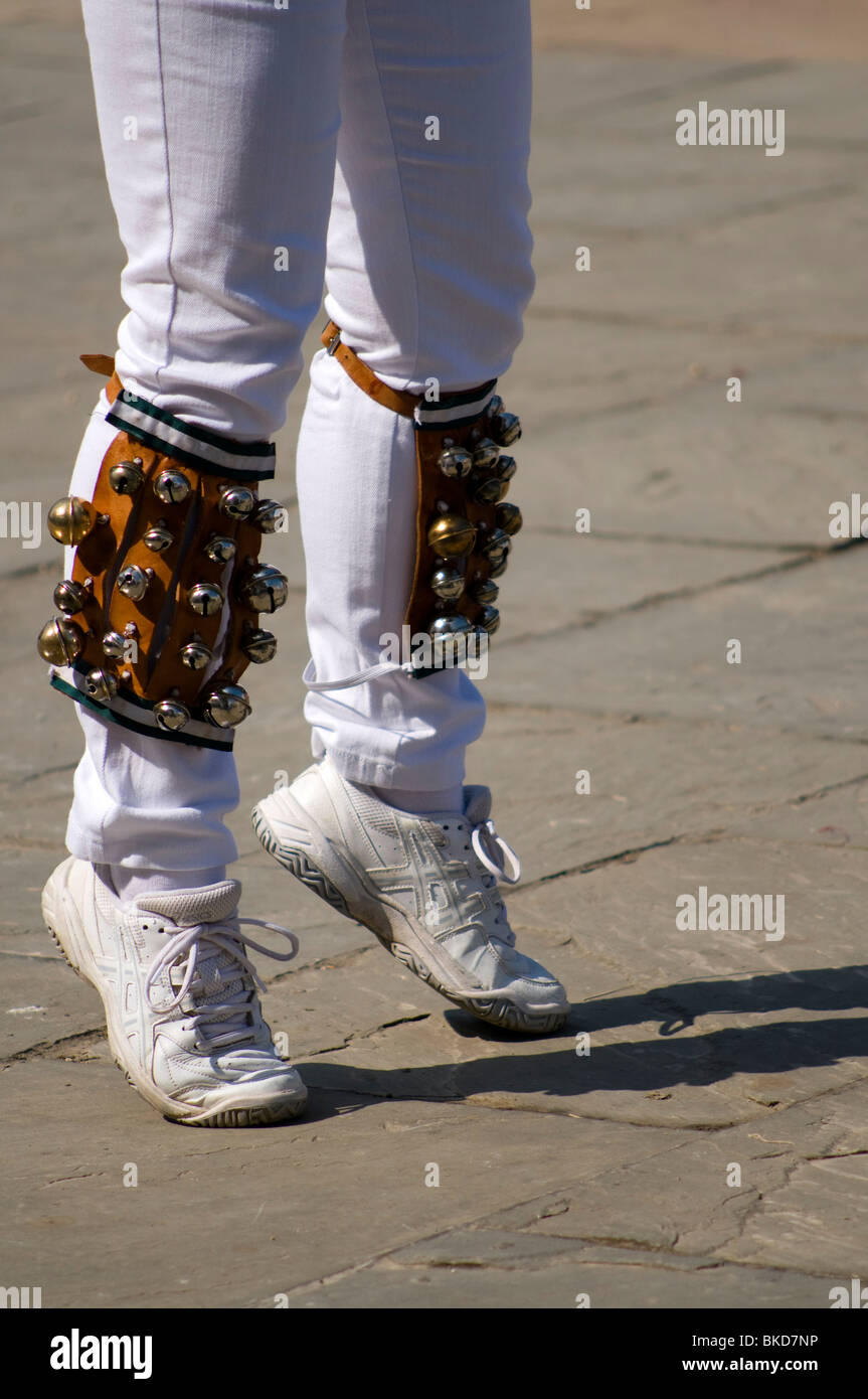 Detail of Morris dancers' legs in action with bells on Stock Photo - Alamy