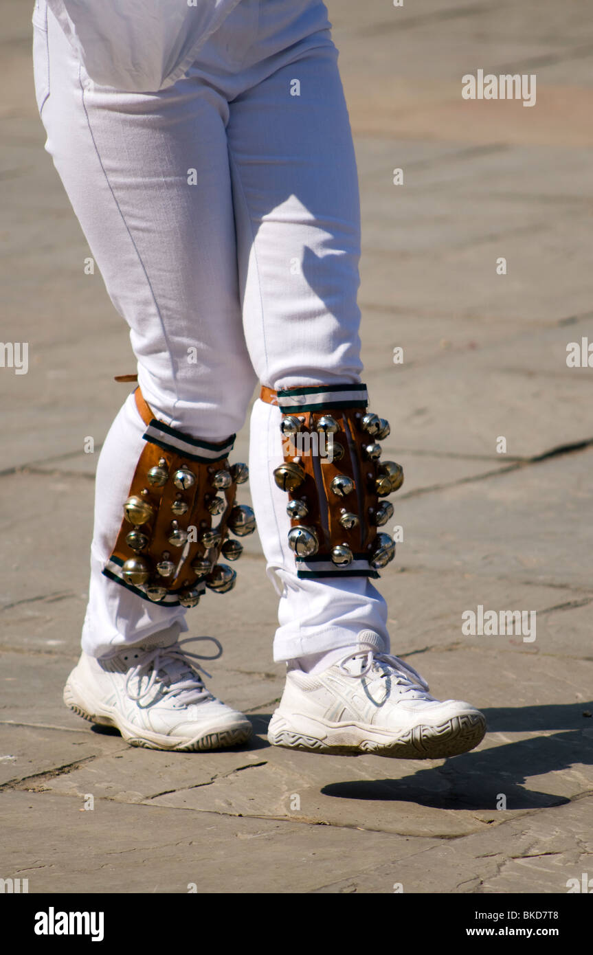 Detail of Morris dancers' legs in action with bells on Stock Photo - Alamy
