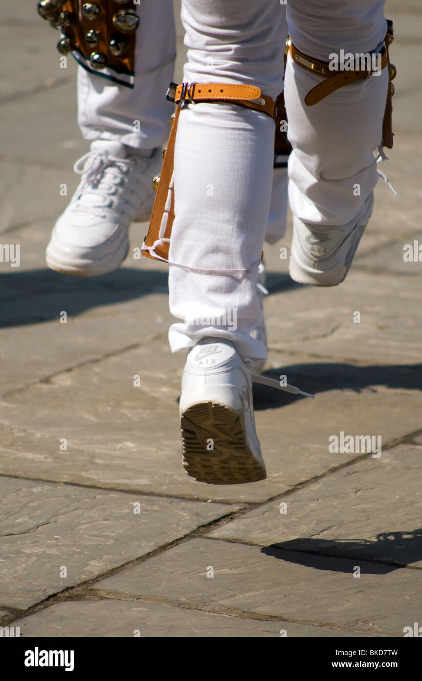 Detail of Morris dancers' legs in action with bells on Stock Photo - Alamy