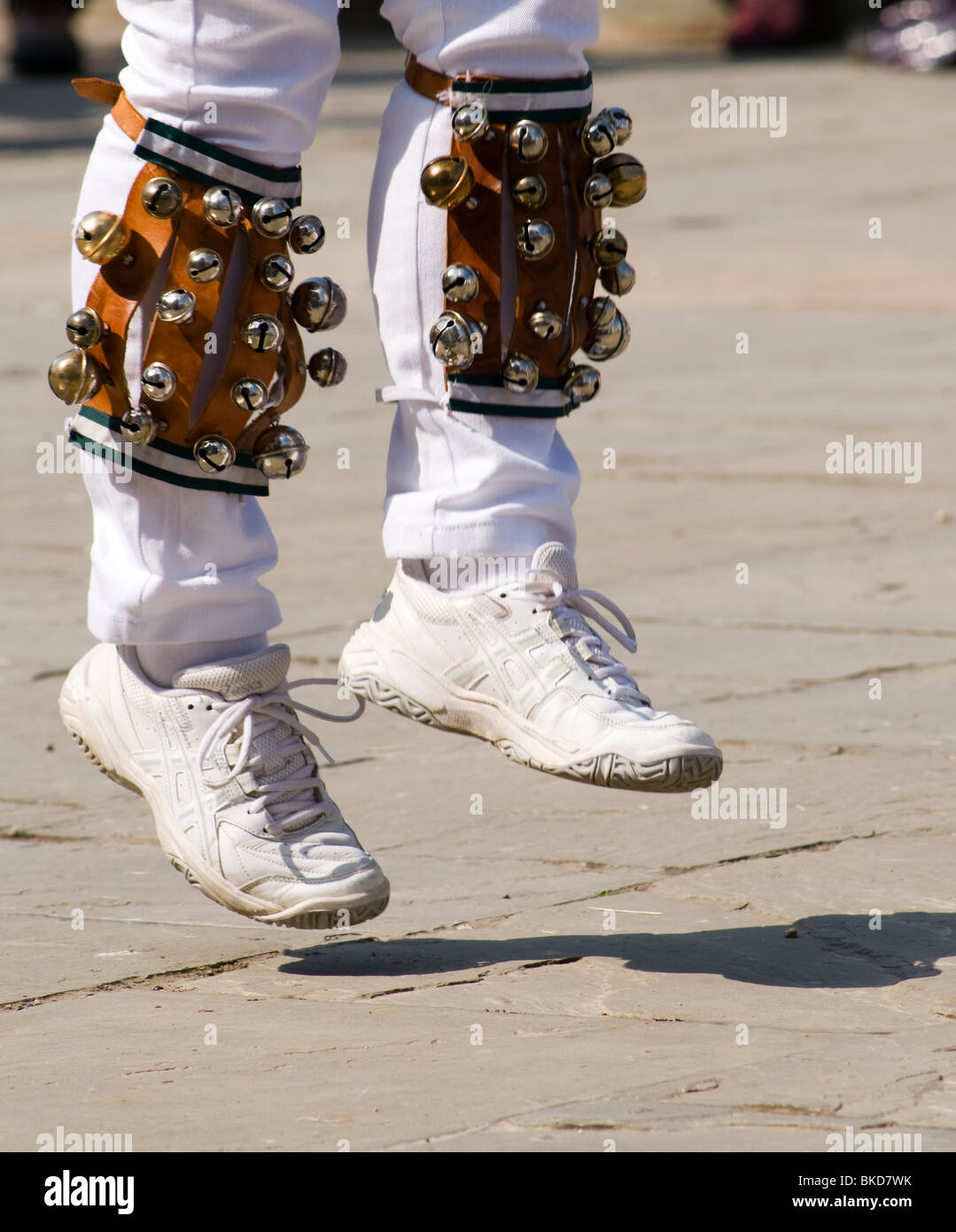 Detail of Morris dancers' legs in action with bells on Stock Photo - Alamy
