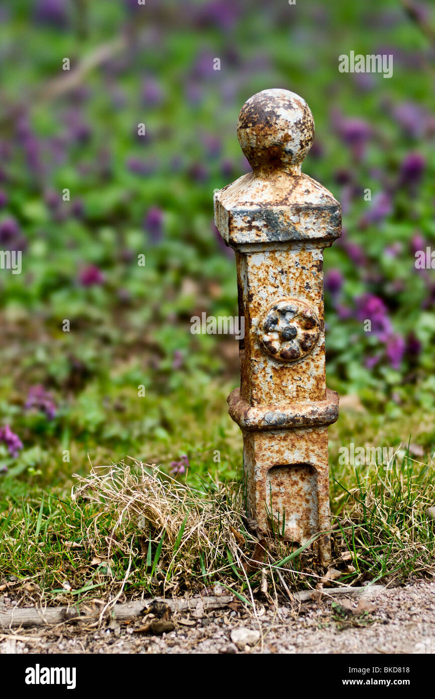 Rusty post at the roadside Stock Photo - Alamy