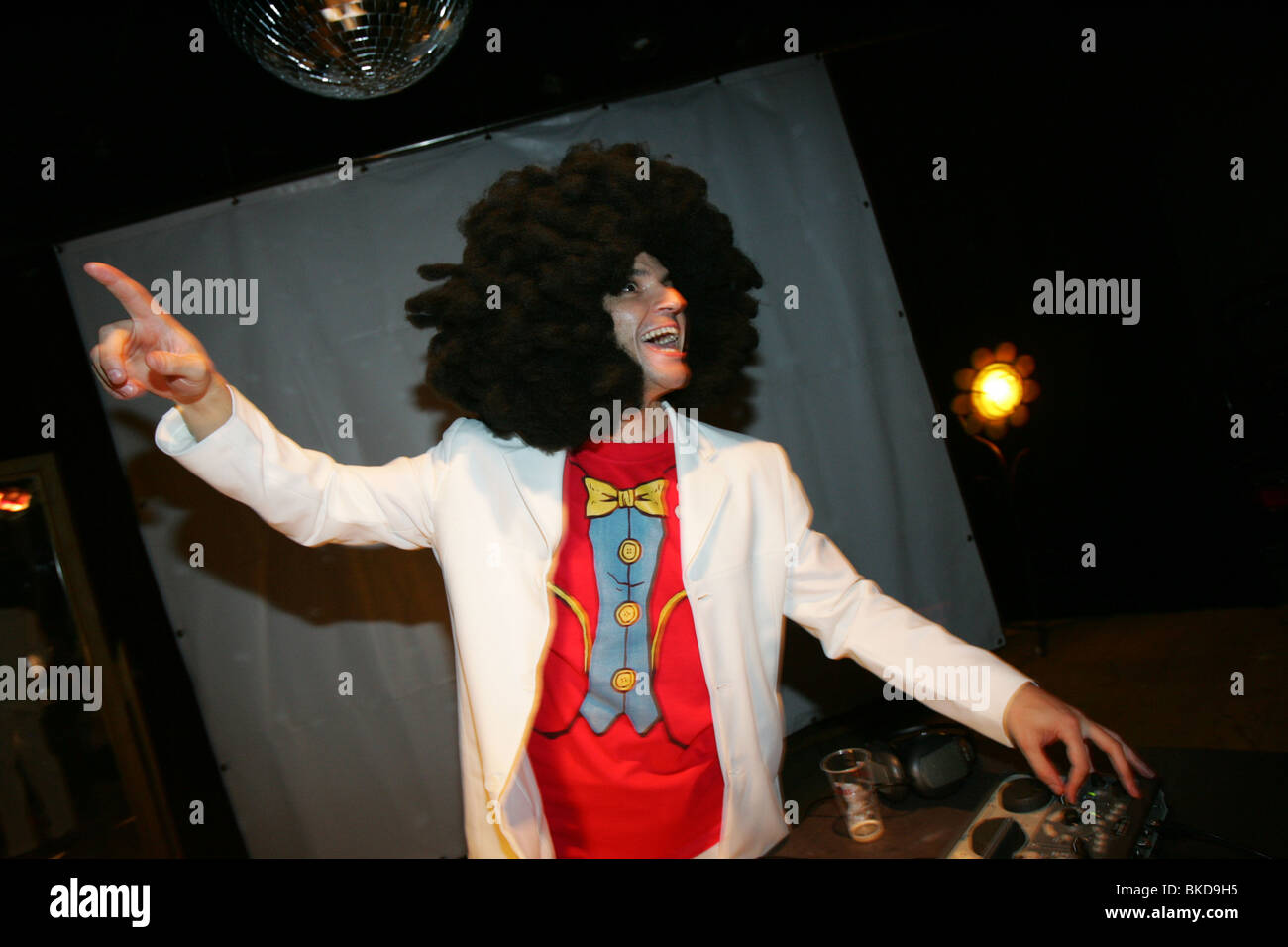 DJ mixing songs at a party Stock Photo - Alamy