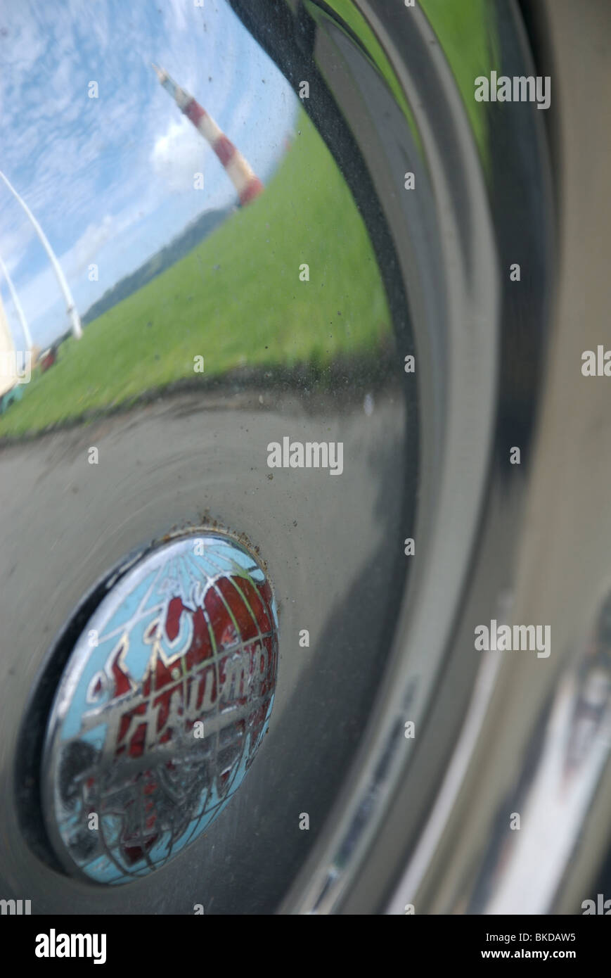 Smeaton's Tower lighthouse reflected in the hubcap of a Triumph Classic ...