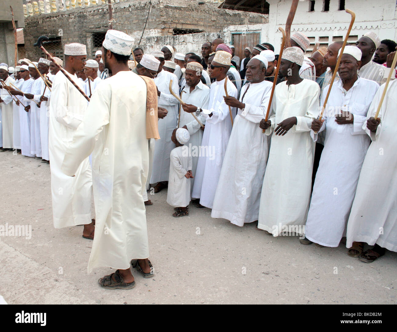 Men perform the Stick dance Kirumbizi during maulidi outside Riyadha ...