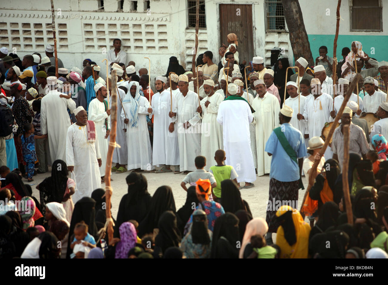 Men perform the Stick dance Kirumbizi during maulidi outside Riyadha ...