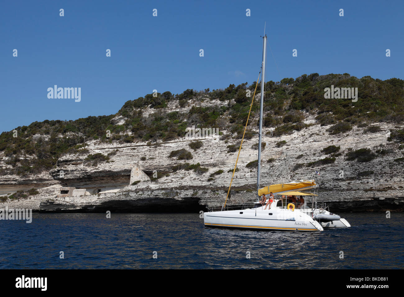 Sailboat visiting bonifacio cliffs Stock Photo - Alamy