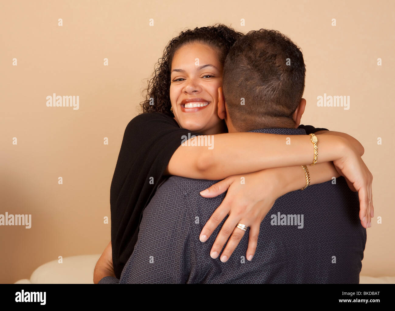 Wife Hugging Her Husband Stock Photo - Alamy