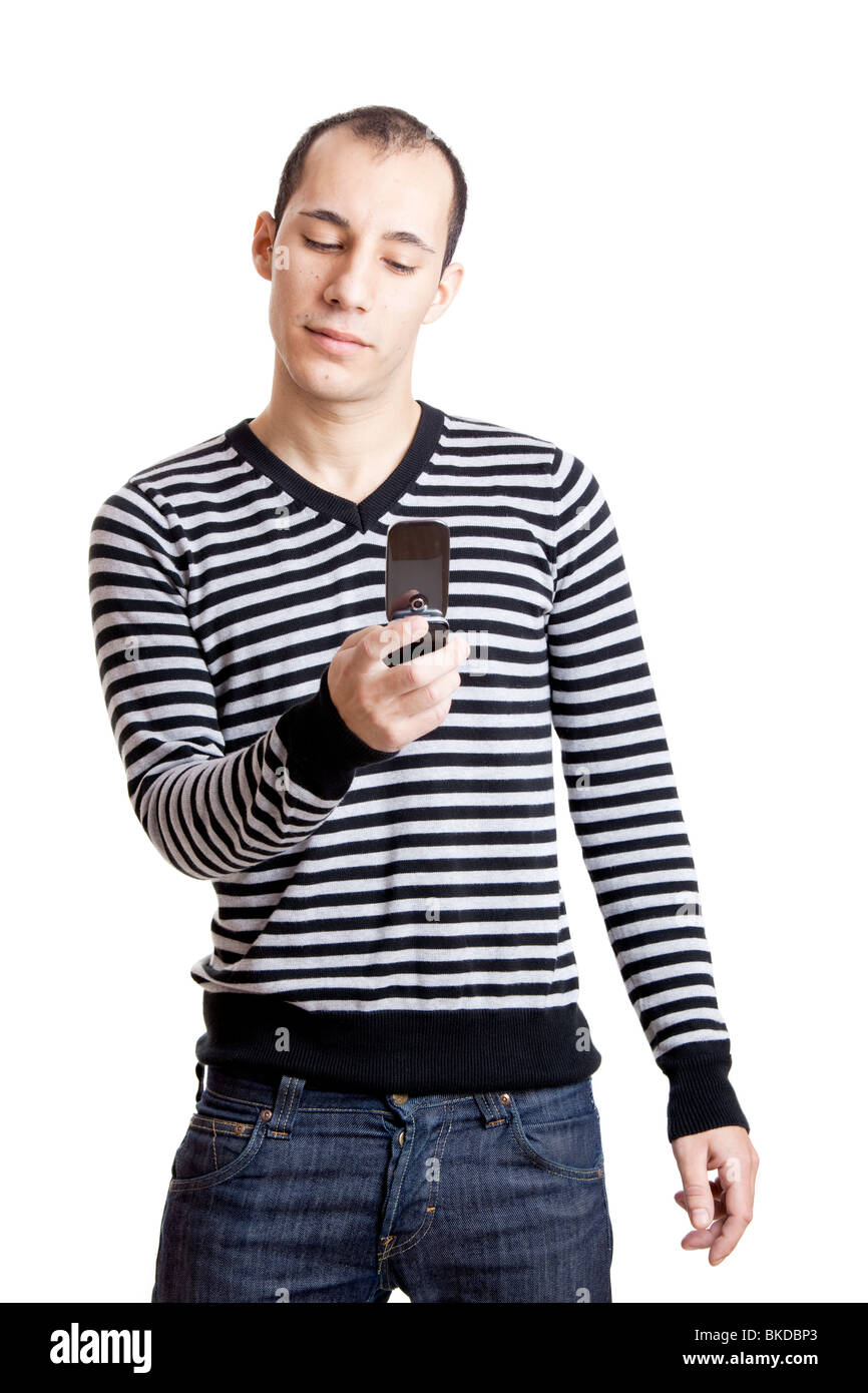 Happy young guy sending a text message, isolated on white background ...