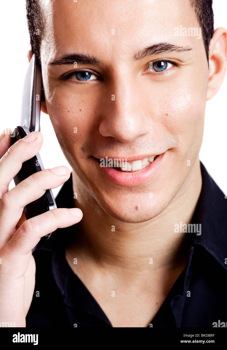 Happy young guy talking on cellphone isolated on white background Stock ...