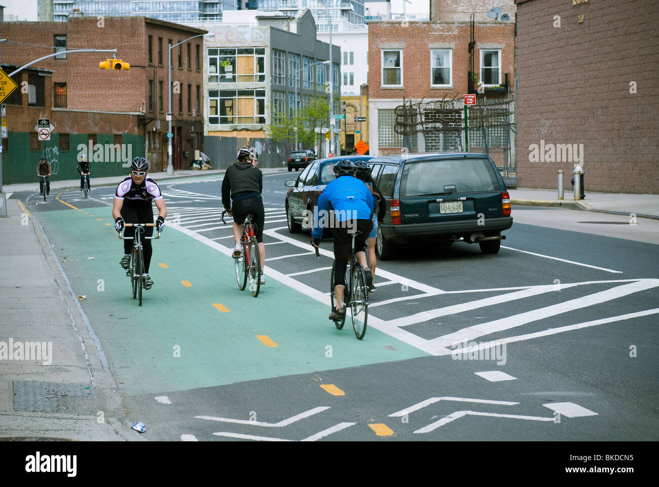 Bicyclists use the popular Kent Avenue bike path in the Williamsburg ...