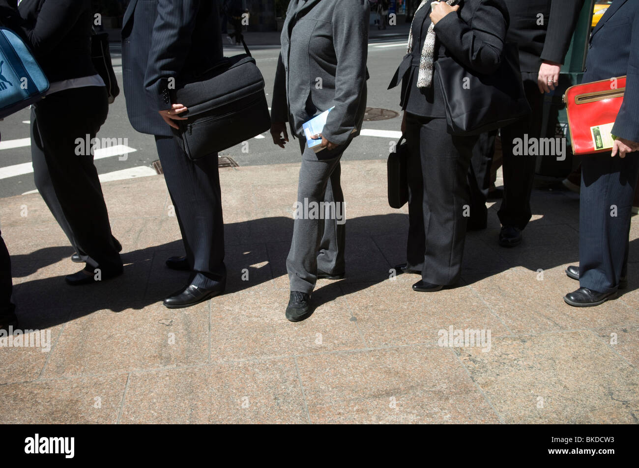Job seekers line up for a job fair in midtown in New York on Tuesday ...