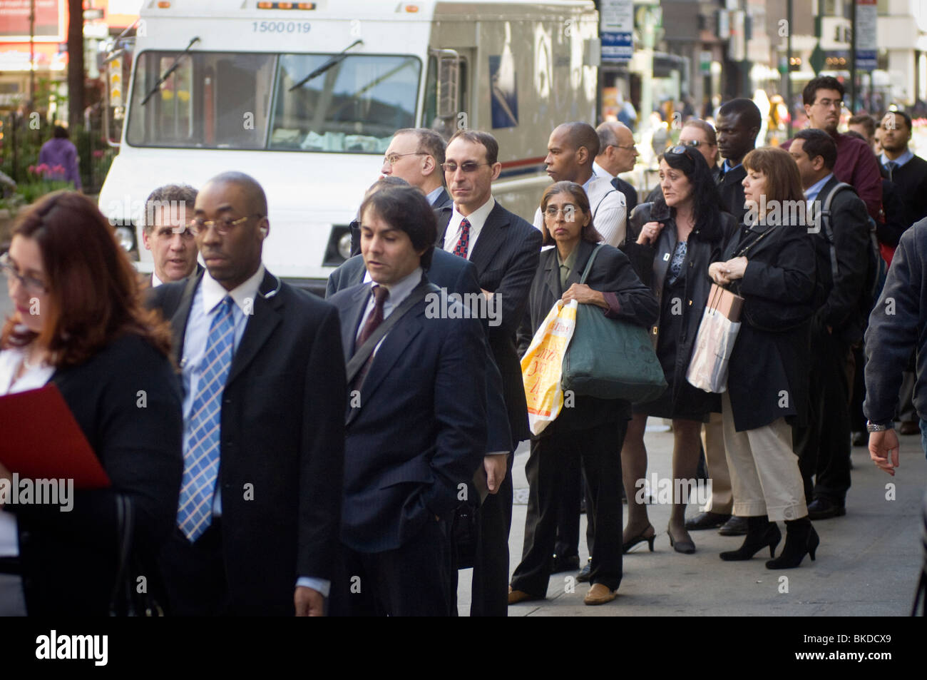Job seekers line up for a job fair in midtown in New York on Tuesday ...
