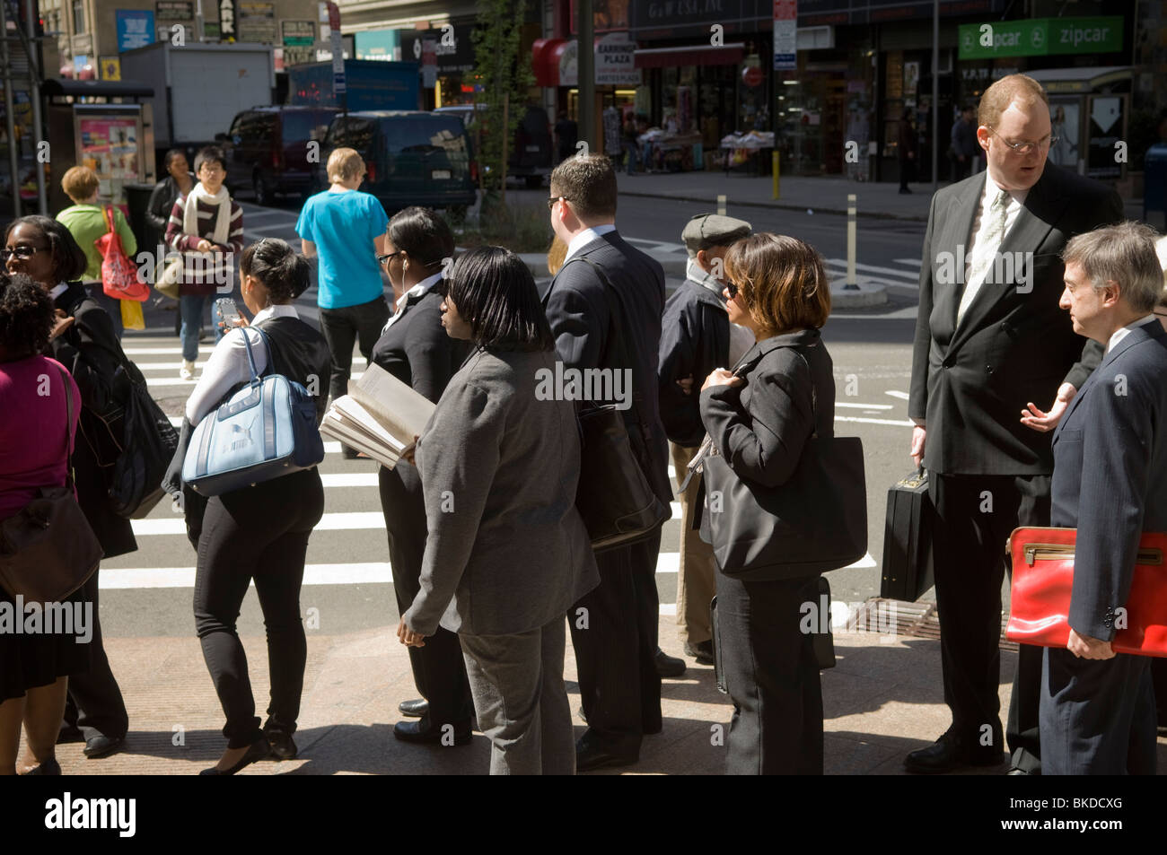 Job seekers line up for a job fair in midtown in New York on Tuesday ...