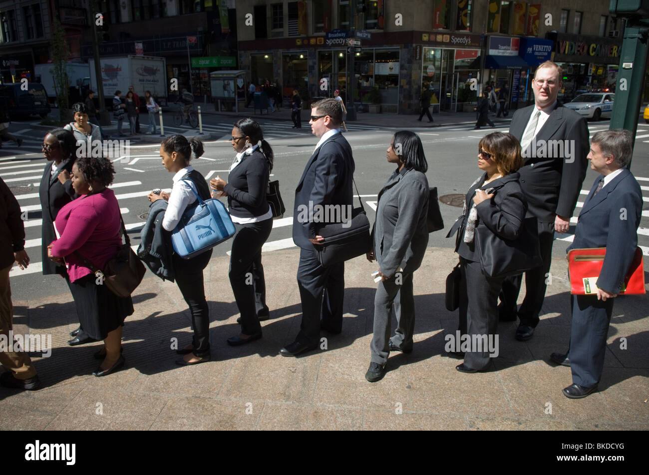 Job seekers line up for a job fair in midtown in New York on Tuesday ...