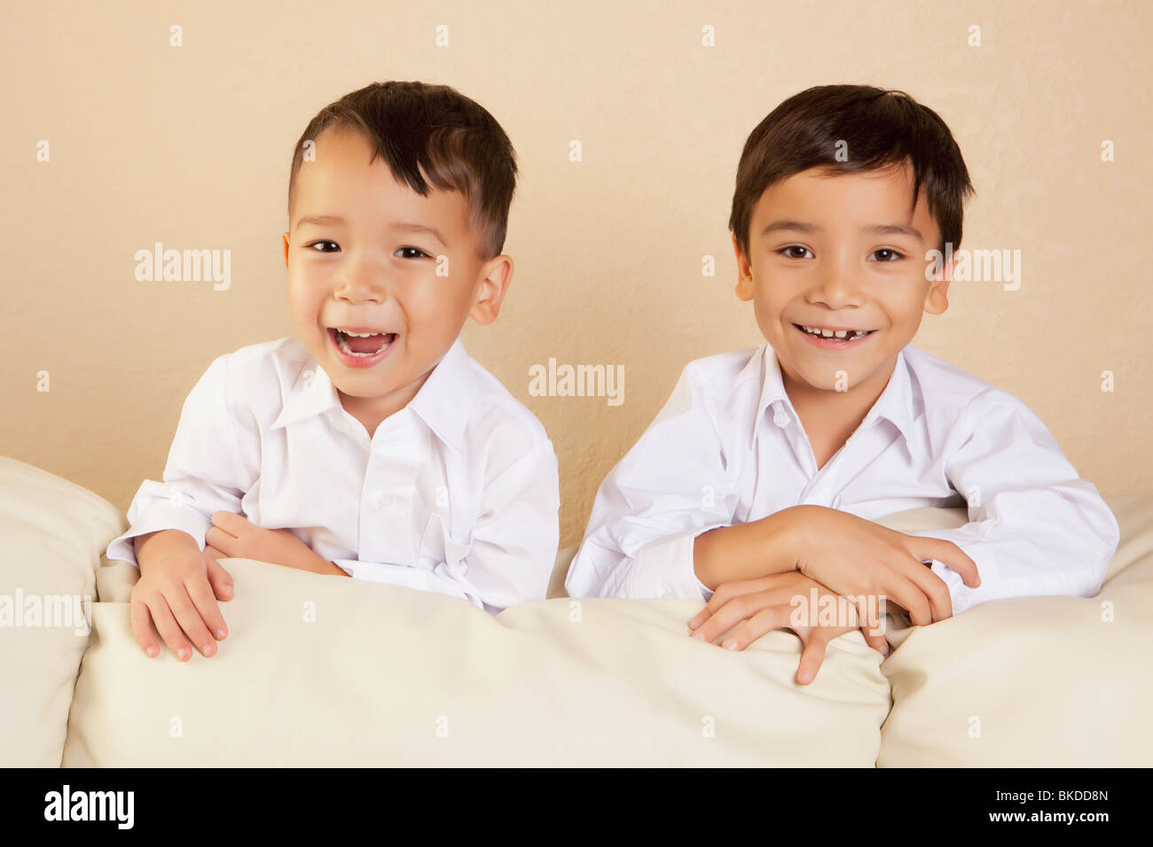 Brothers eye contact half length hi-res stock photography and images ...