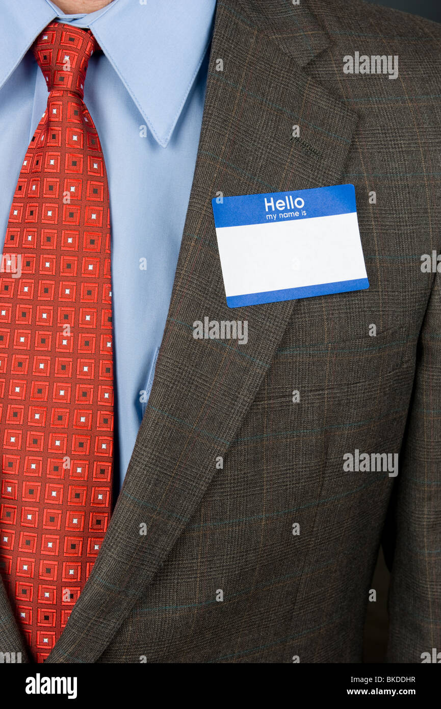 A businessman wearing a blank name tag and a sharp business suit Stock ...