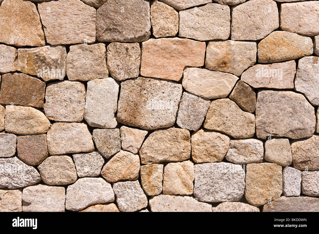 A stone wall during a bright day Stock Photo - Alamy