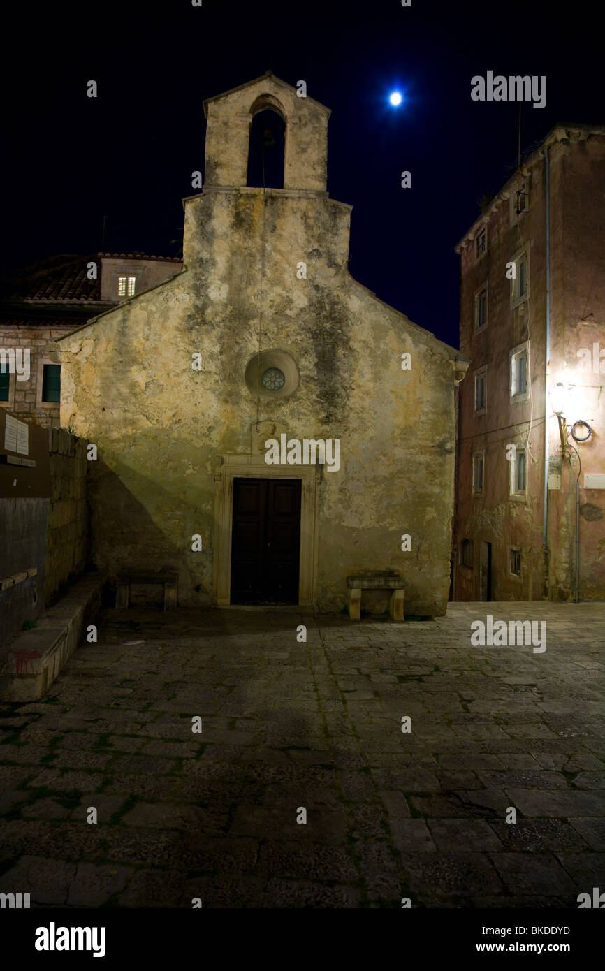Moon over church Stock Photo - Alamy