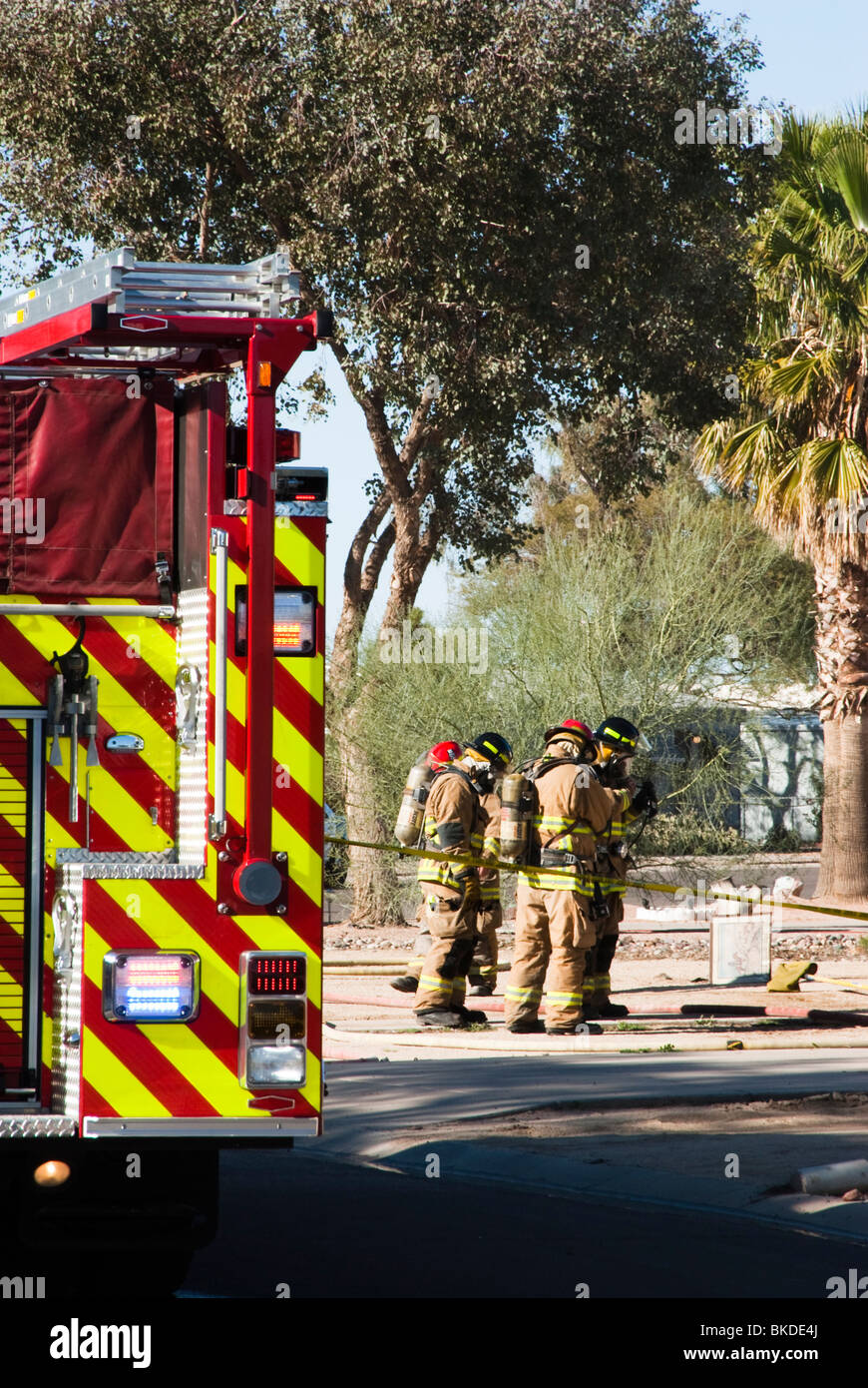 firefighters respond to a house fire in a residential area Stock Photo ...