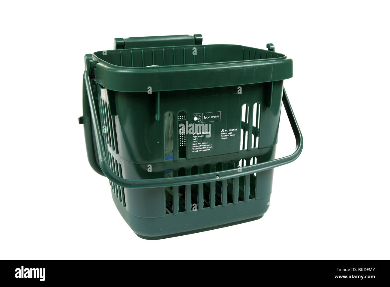 A Green food waste recycling dustbin for use in the kitchen against a ...