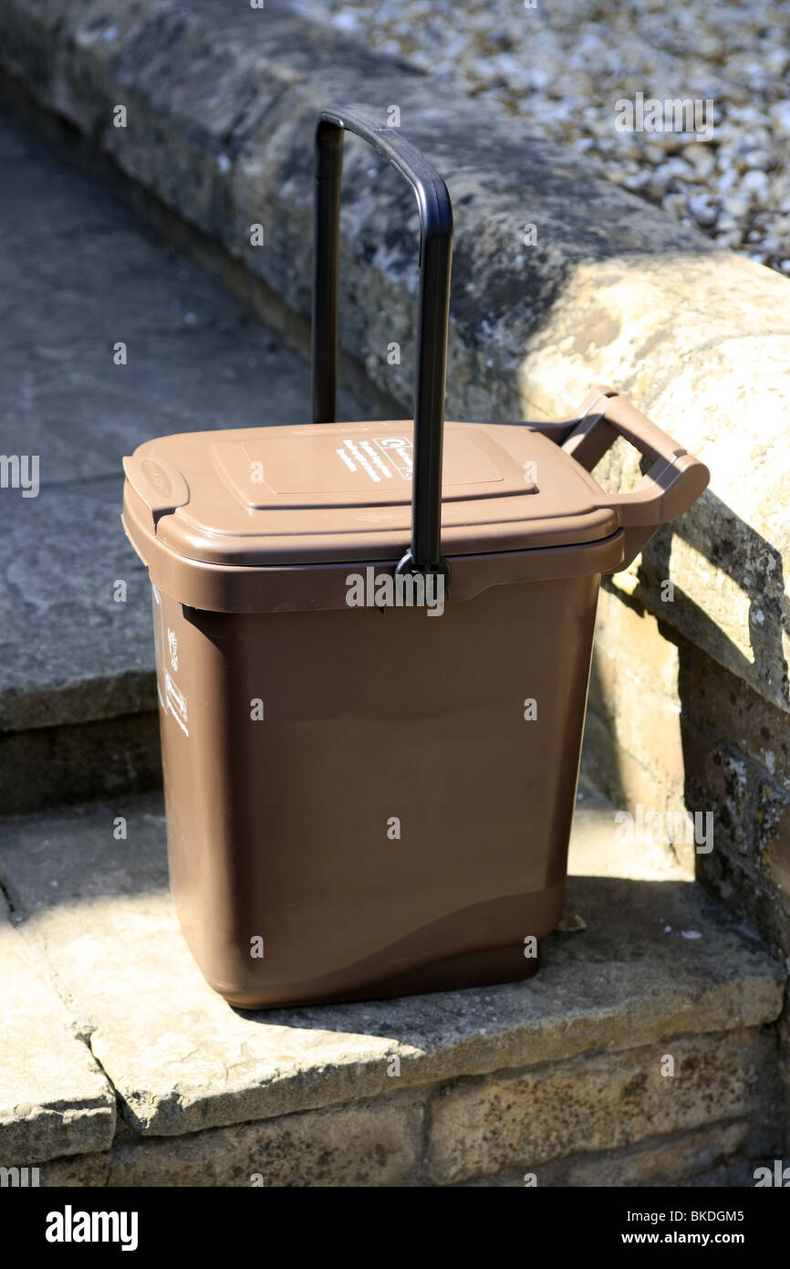 A Brown food waste recycling dustbin outside ready to be emptied by the ...