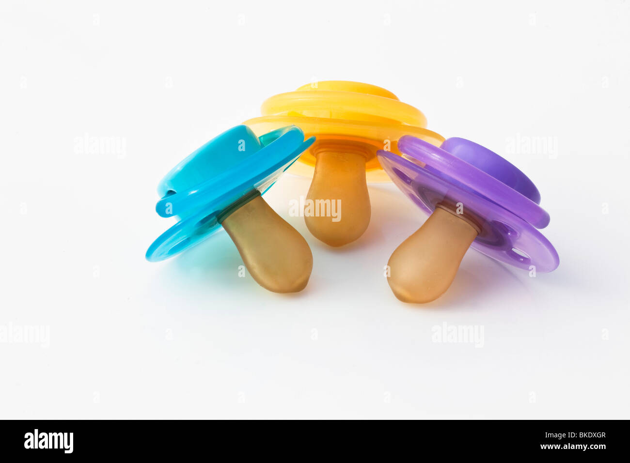 three colourful children's dummies on a plain white backdrop Stock ...
