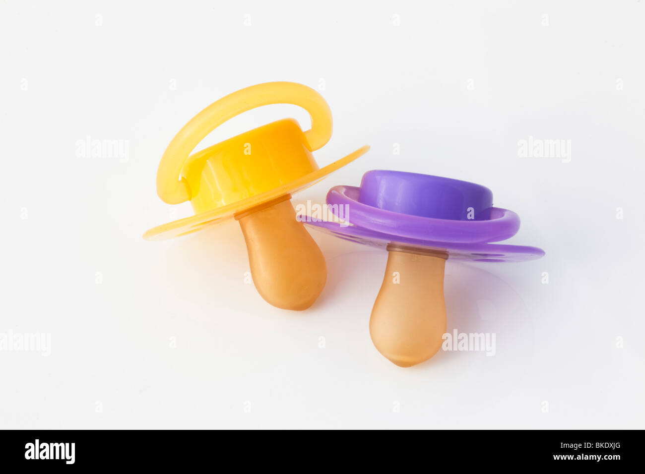 two colourful children's dummies on a plain white backdrop Stock Photo ...