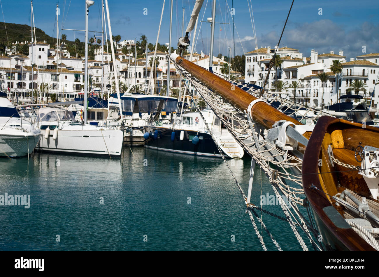 Bowsprit of a wooden sailing boat detailed against the backdrop of ...