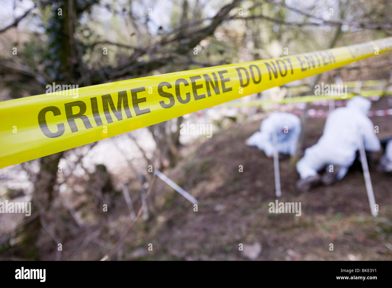 police scenes of crime officers investigate a murder scene on the banks ...