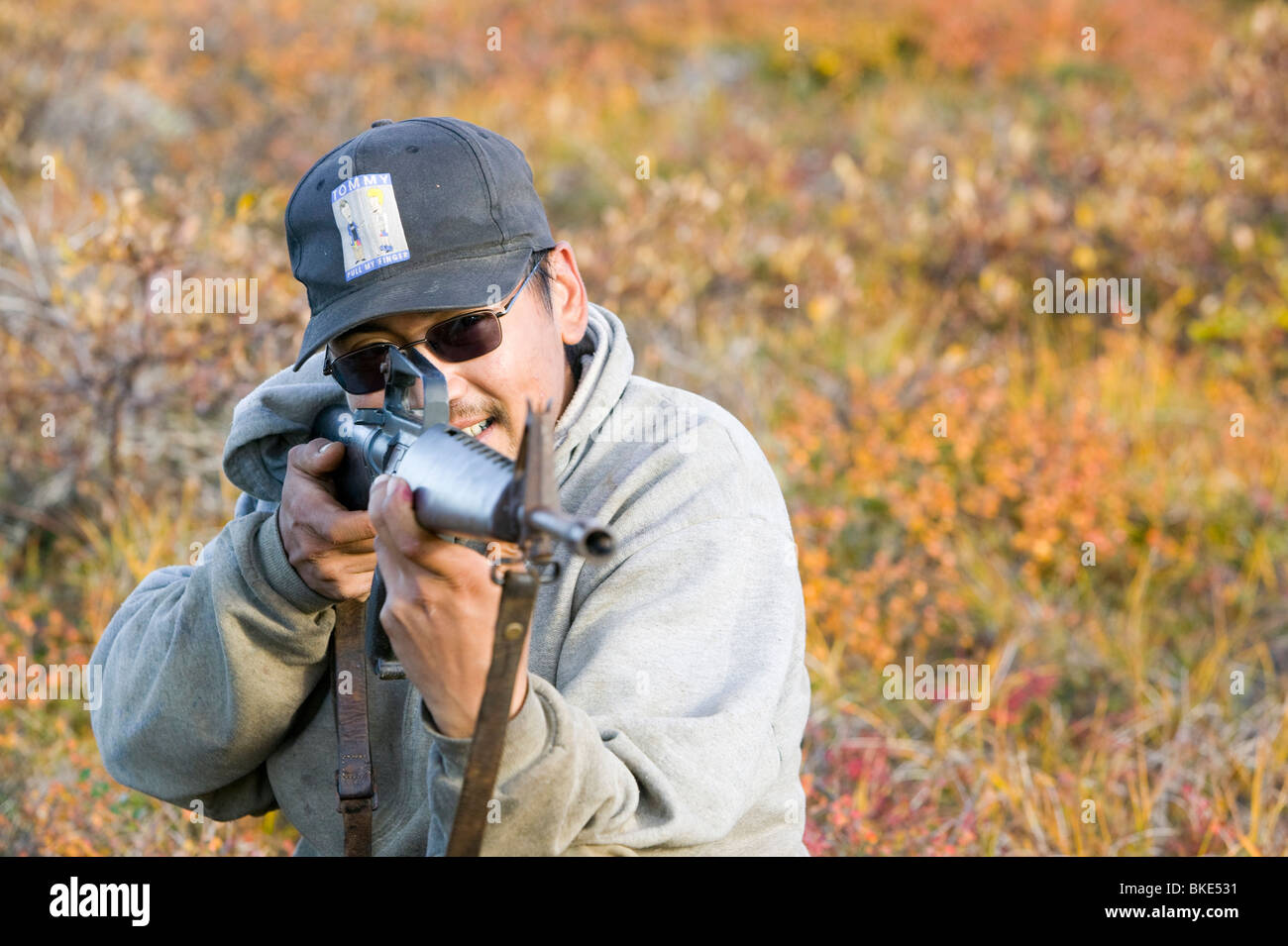 J J Weyouanna hunting Caribou on the tundra at the mouth of the ...