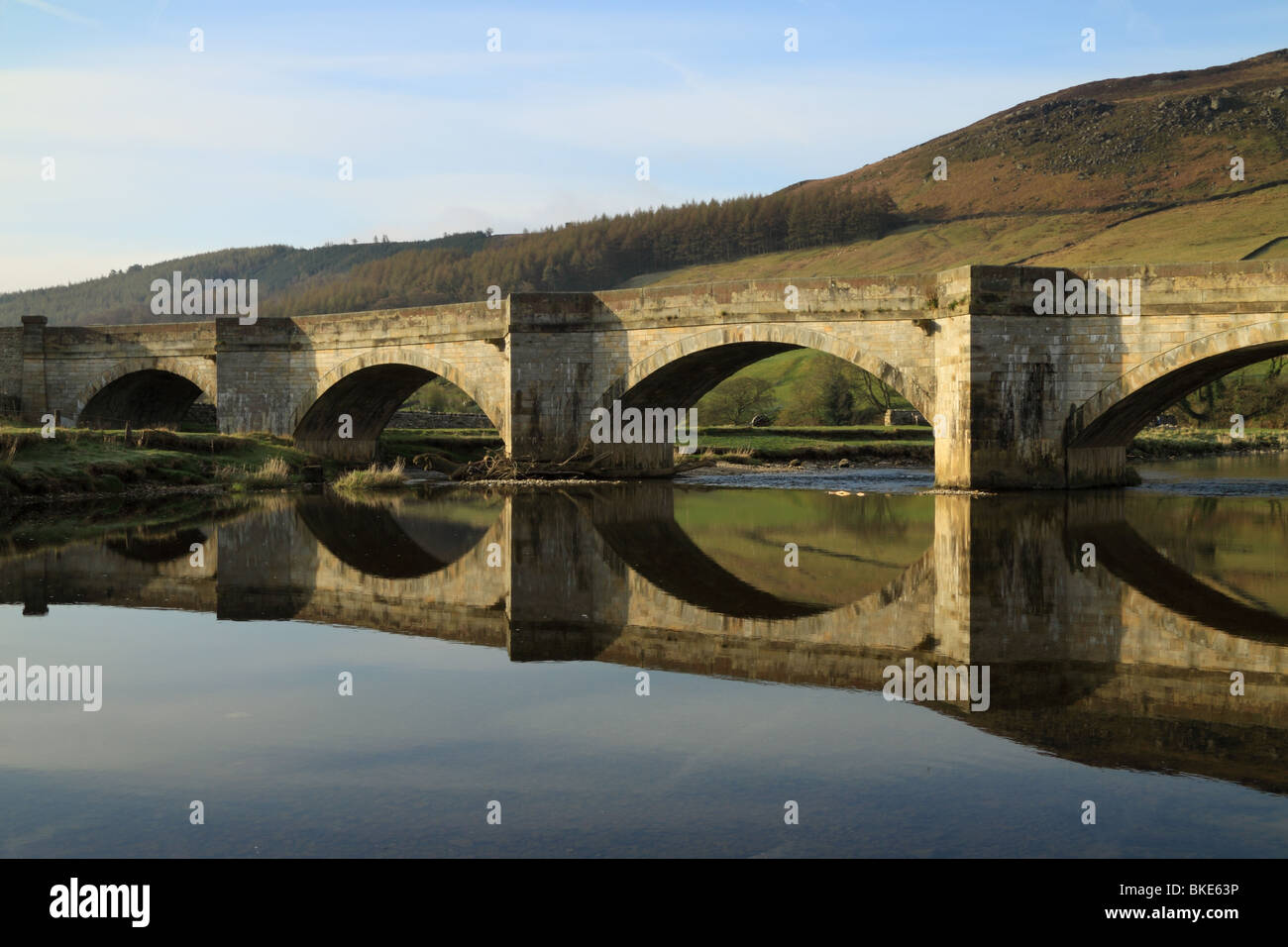The stone arched bridge over the River Wharfe at Burnsall in Upper ...