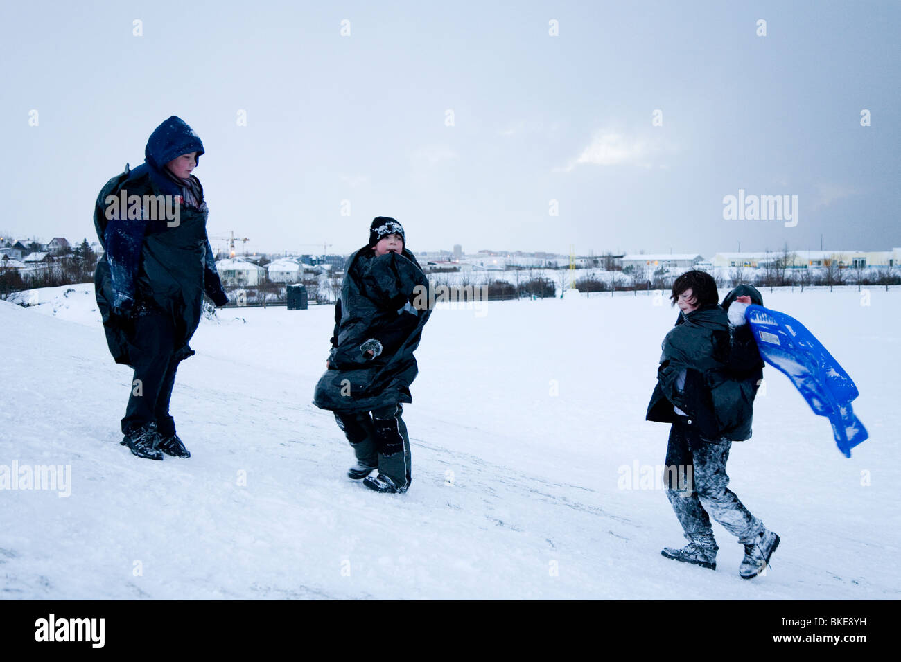 Kids playing on snow hi-res stock photography and images - Alamy