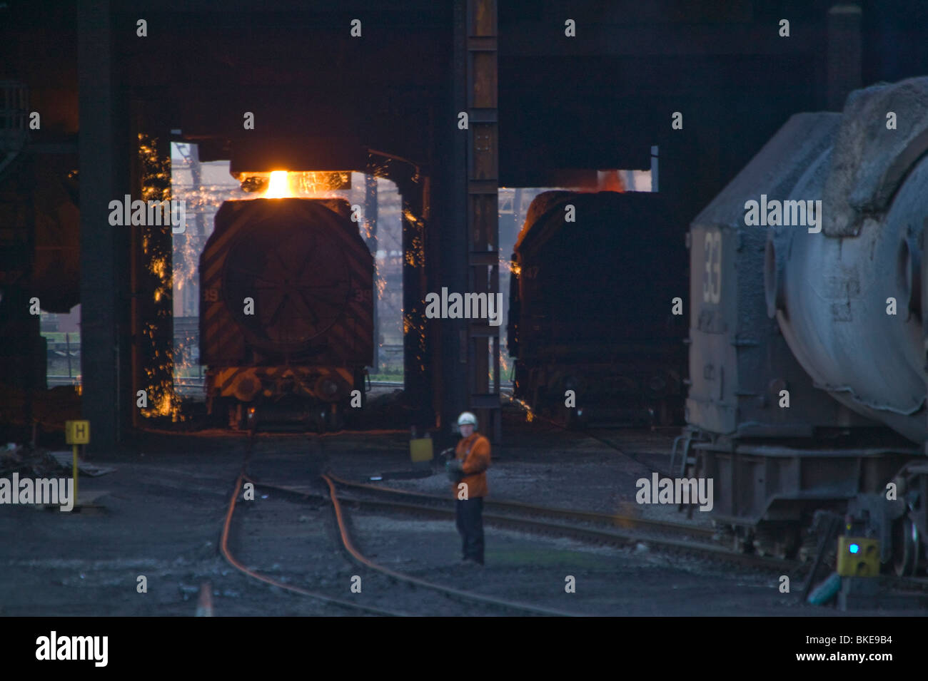 Molten steel being poured into a train at the Corus steelworks at ...