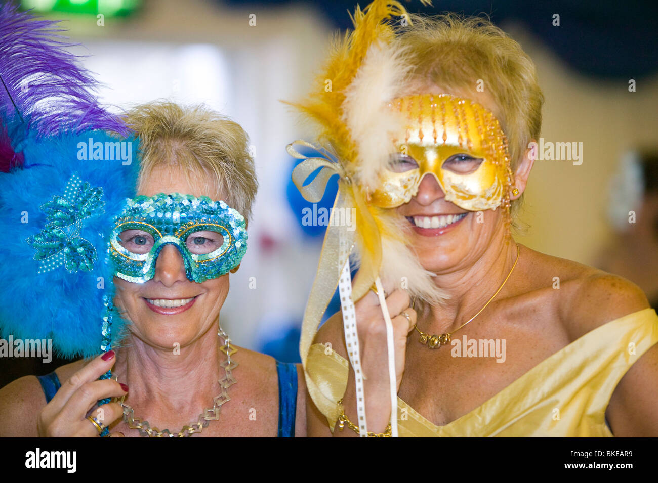 Women at a masquerade charity ball Stock Photo - Alamy