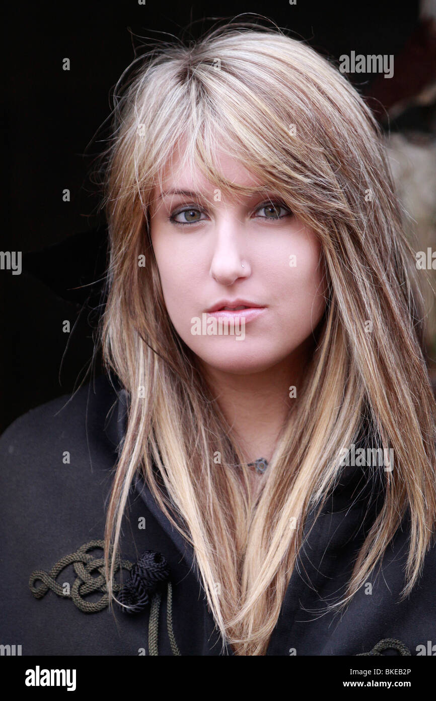 teenage girl with pouting expression in black long hair Stock Photo - Alamy