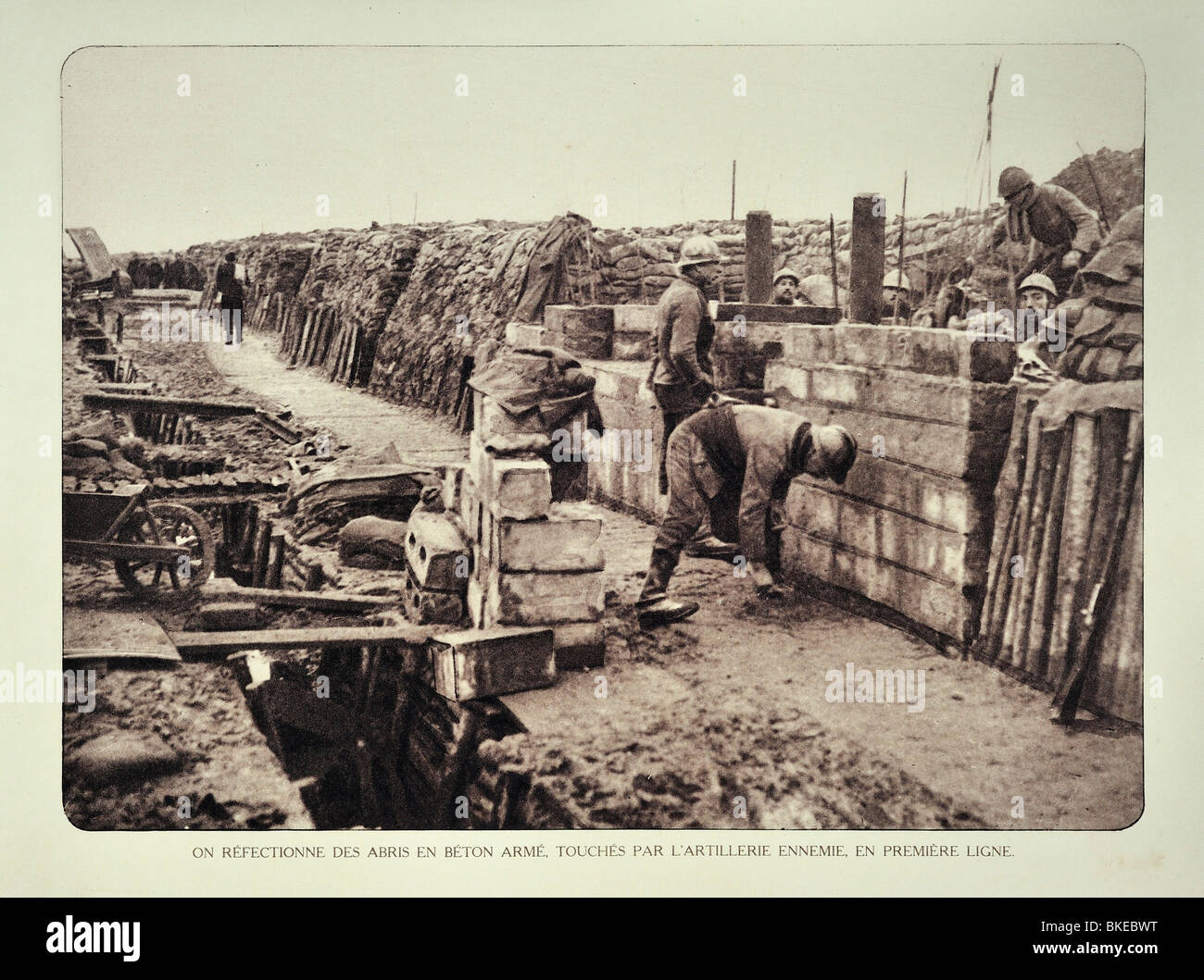 Belgian WWI soldiers repairing bombed shelter in trench at battlefield ...