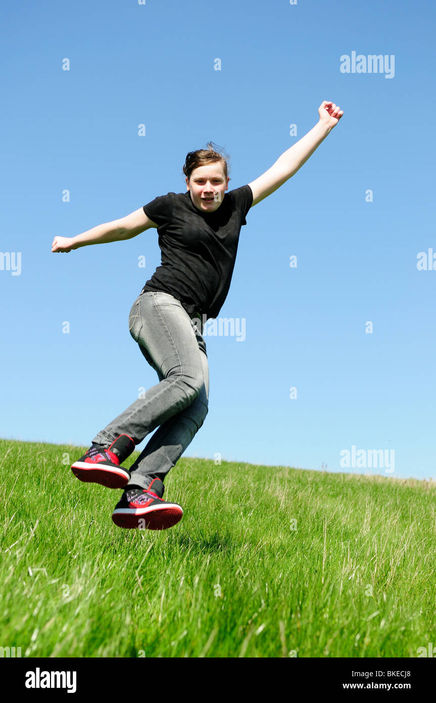 Teenager Jumping For Joy Stock Photo - Alamy