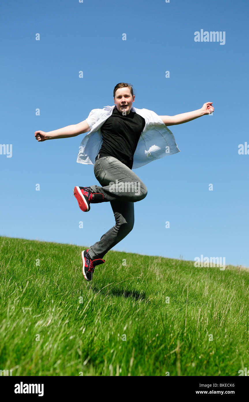 Teenager Jumping For Joy Stock Photo - Alamy