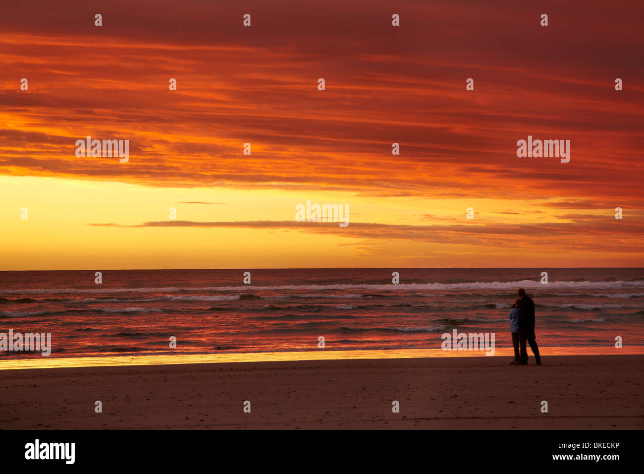 Sunset over Southern Ocean and People, Ocean Beach, near Strahan ...