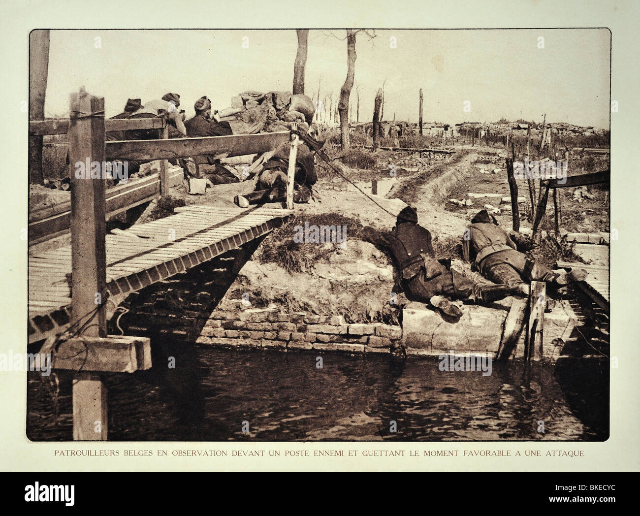 WW1 soldiers on reconnaissance patrol observing the enemy from bridge ...