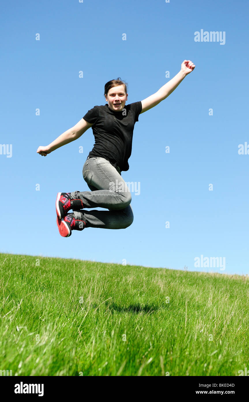 Teenager Jumping For Joy Stock Photo - Alamy