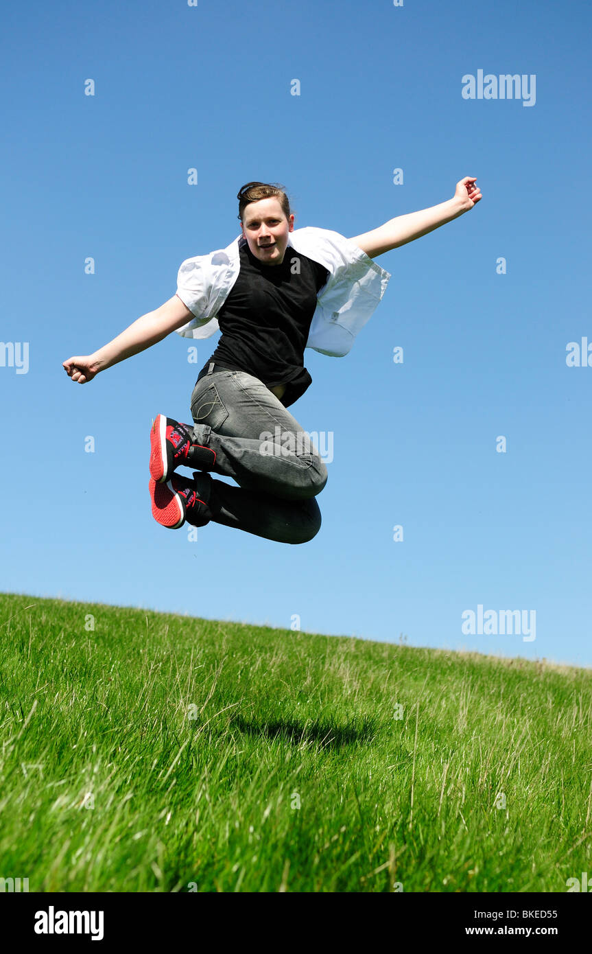 Teenager Jumping For Joy Stock Photo - Alamy