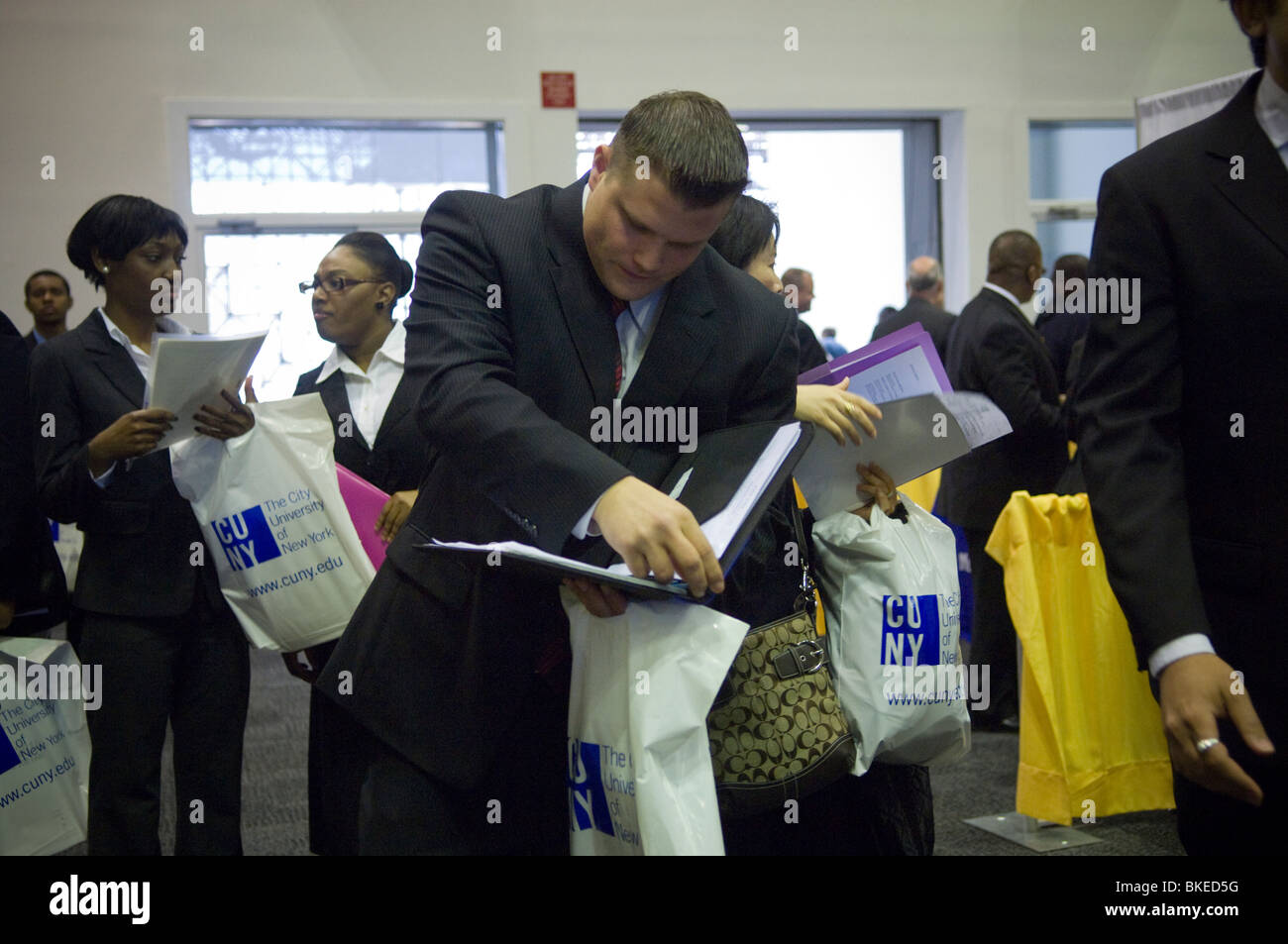 Job seekers attend a college job fair at the Jacob Javits Convention ...