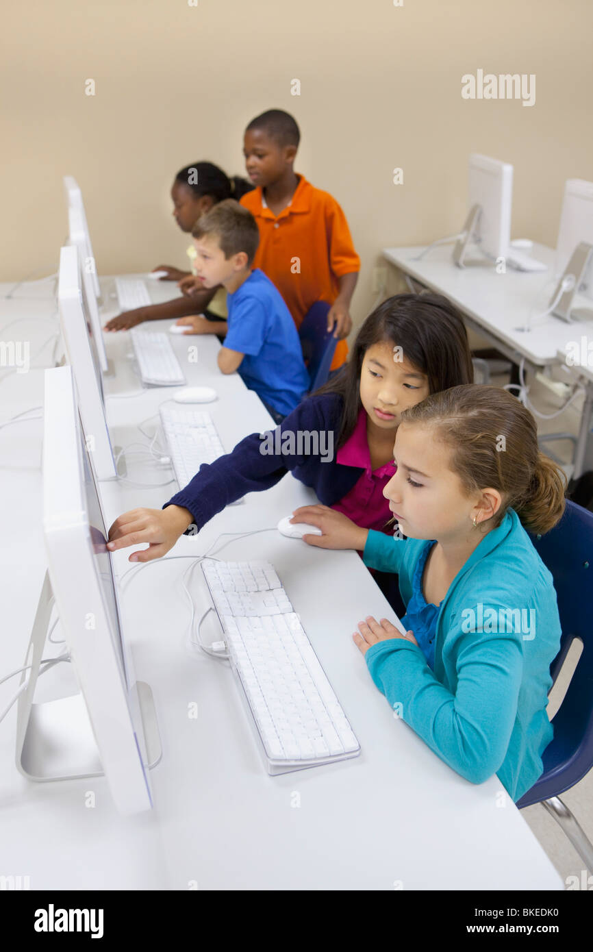Children Working Together On Computers Stock Photo - Alamy
