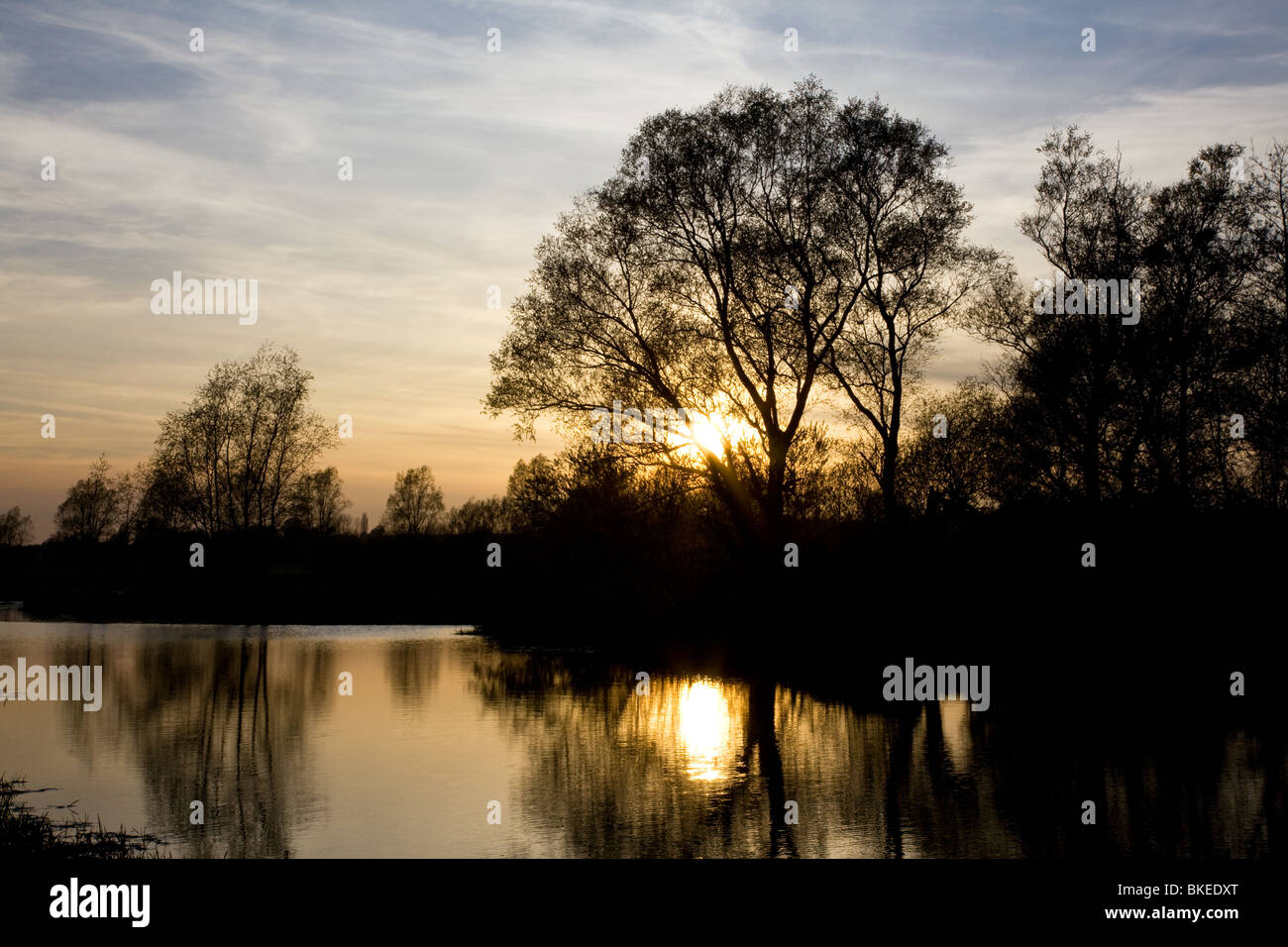 Sunset over a river Stock Photo - Alamy