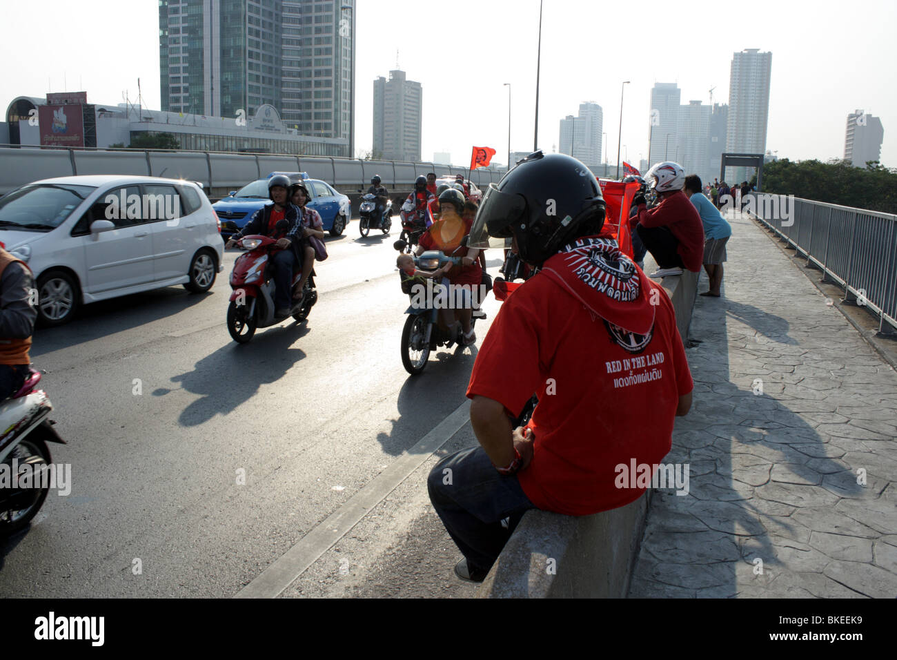 Red-shirted supporters of deposed Thai premier Thaksin Shinawatra wave ...